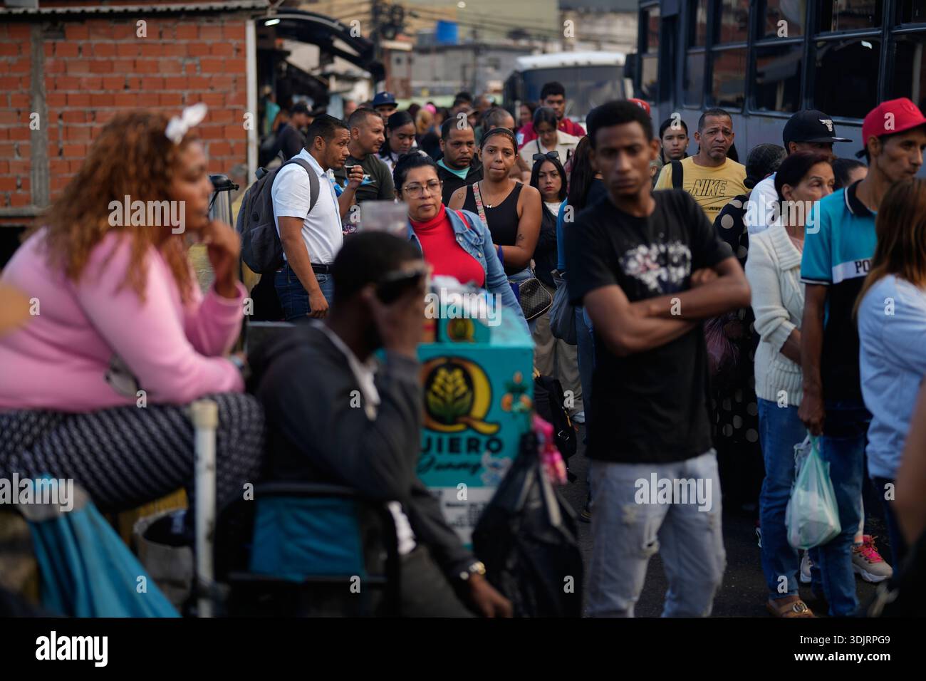 People fill the street at rush hour in Caracas, Venezuela, Wednesday ...