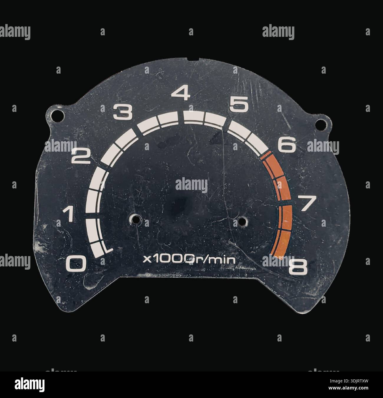 A close-up image of a vintage car speedometer against a black ...