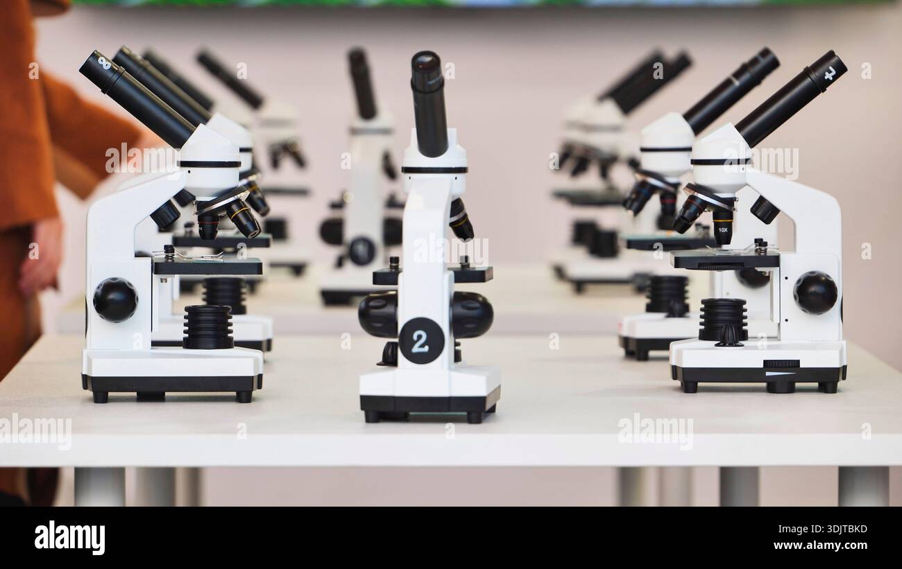 Microscopes lined up in a science laboratory classroom Stock Photo - Alamy