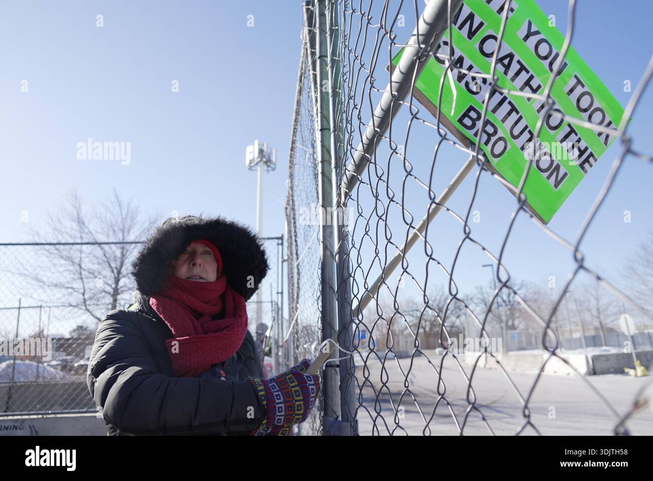 Protester Cindy Leonard holds a sign outside Bishop Whipple Federal ...