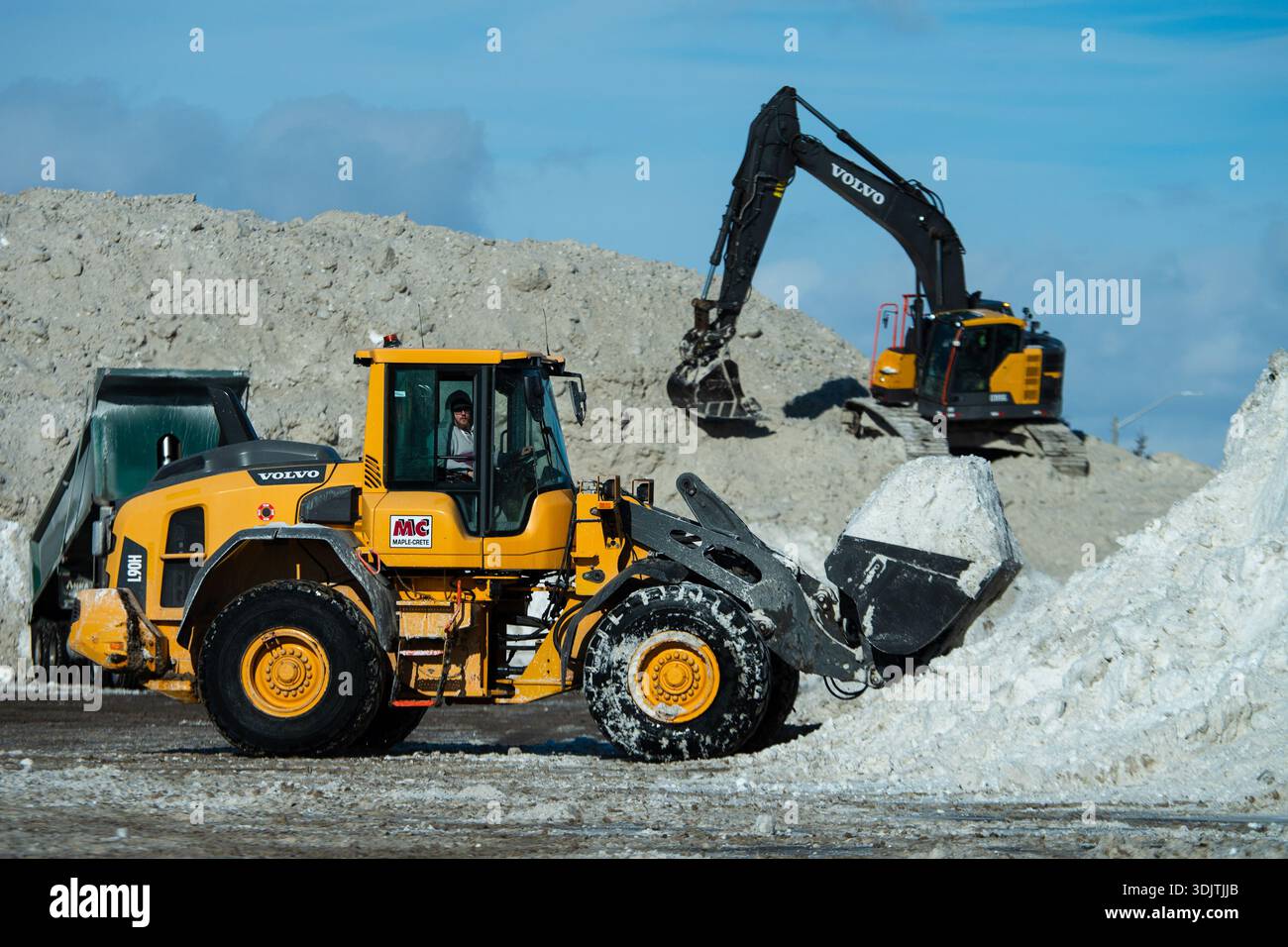 Machines move snow at one of Toronto‚Äôs snow dump sites in North York ...