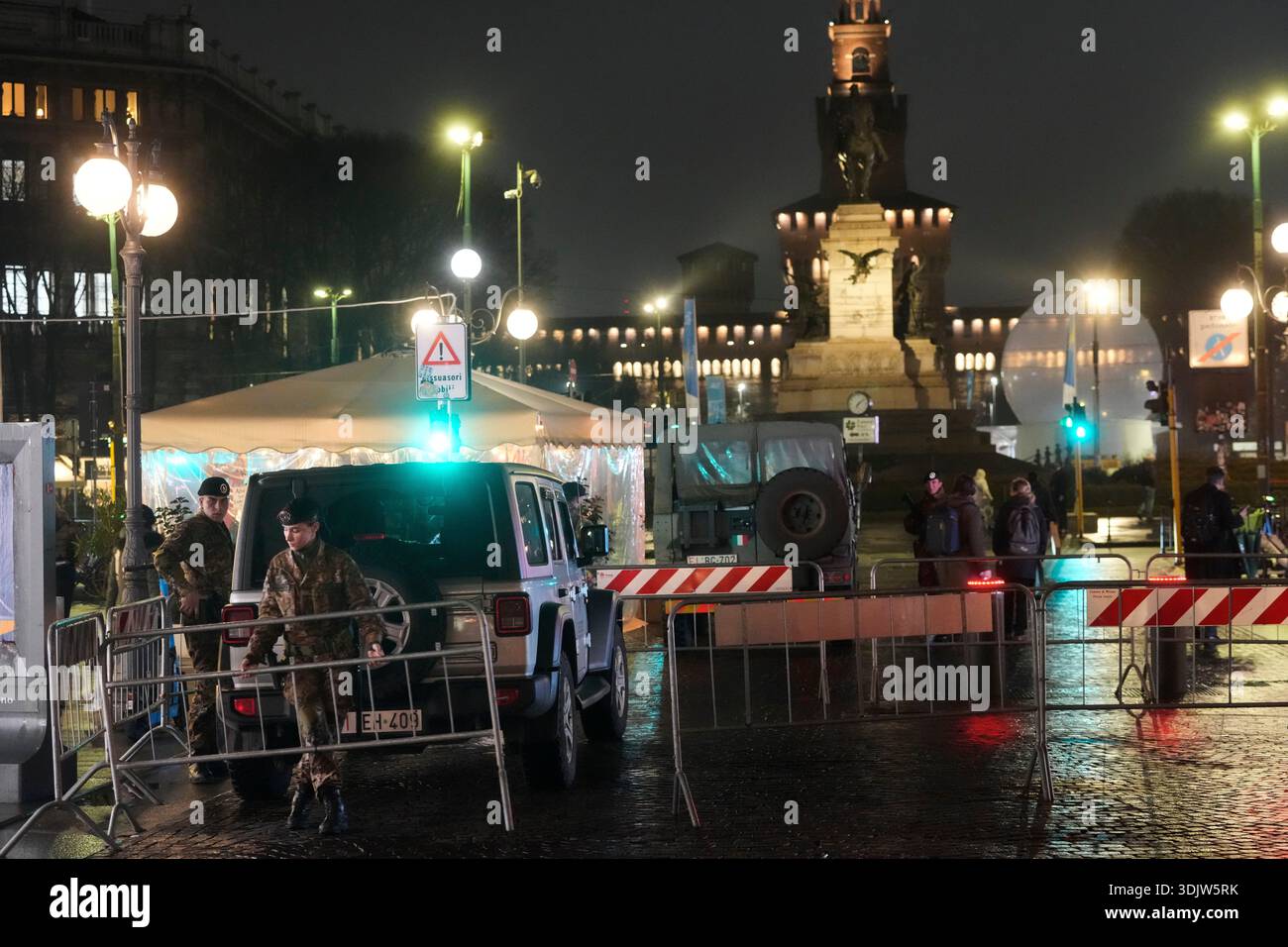 Italian soldiers patrol in front of the Sforzesco Castle, in Milan ...