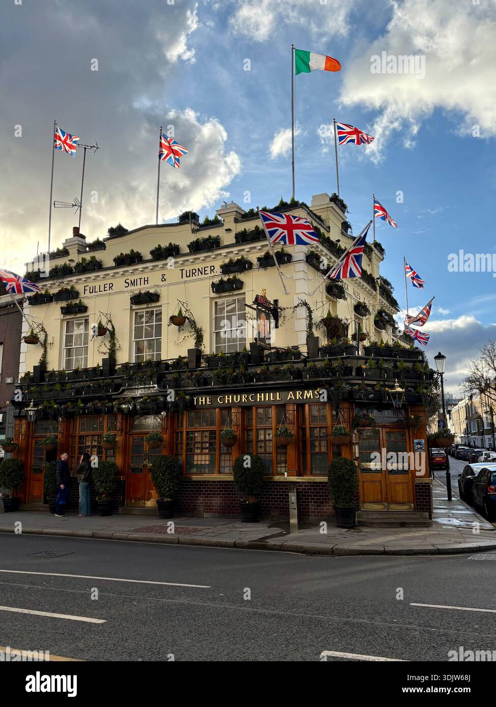 London, UK. 28 January 2026. Union flags fly above The Churchill Arms ...