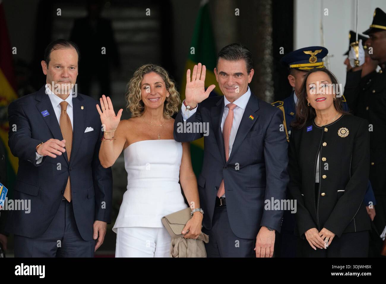Bolivian President Rodrigo Paz and his wife Maria Elena Urquidi wave to ...