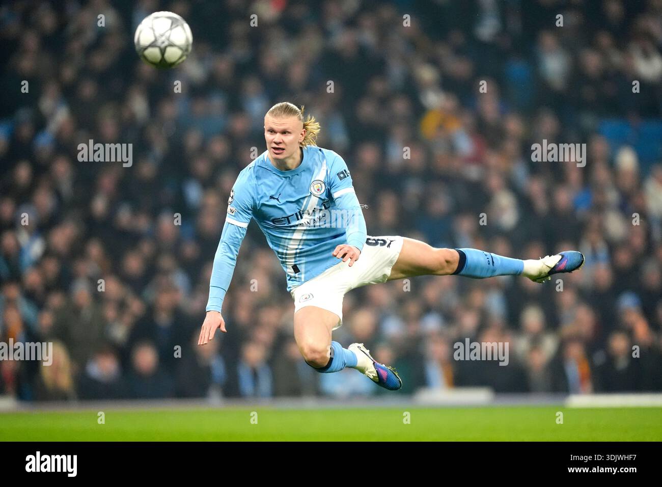 Manchester City's Erling Haaland attempts a headed shot towards goal ...