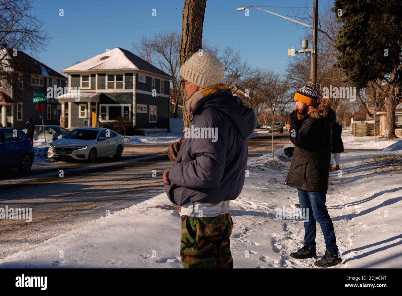 Observers surround a federal immigration officer's vehicle Wednesday ...