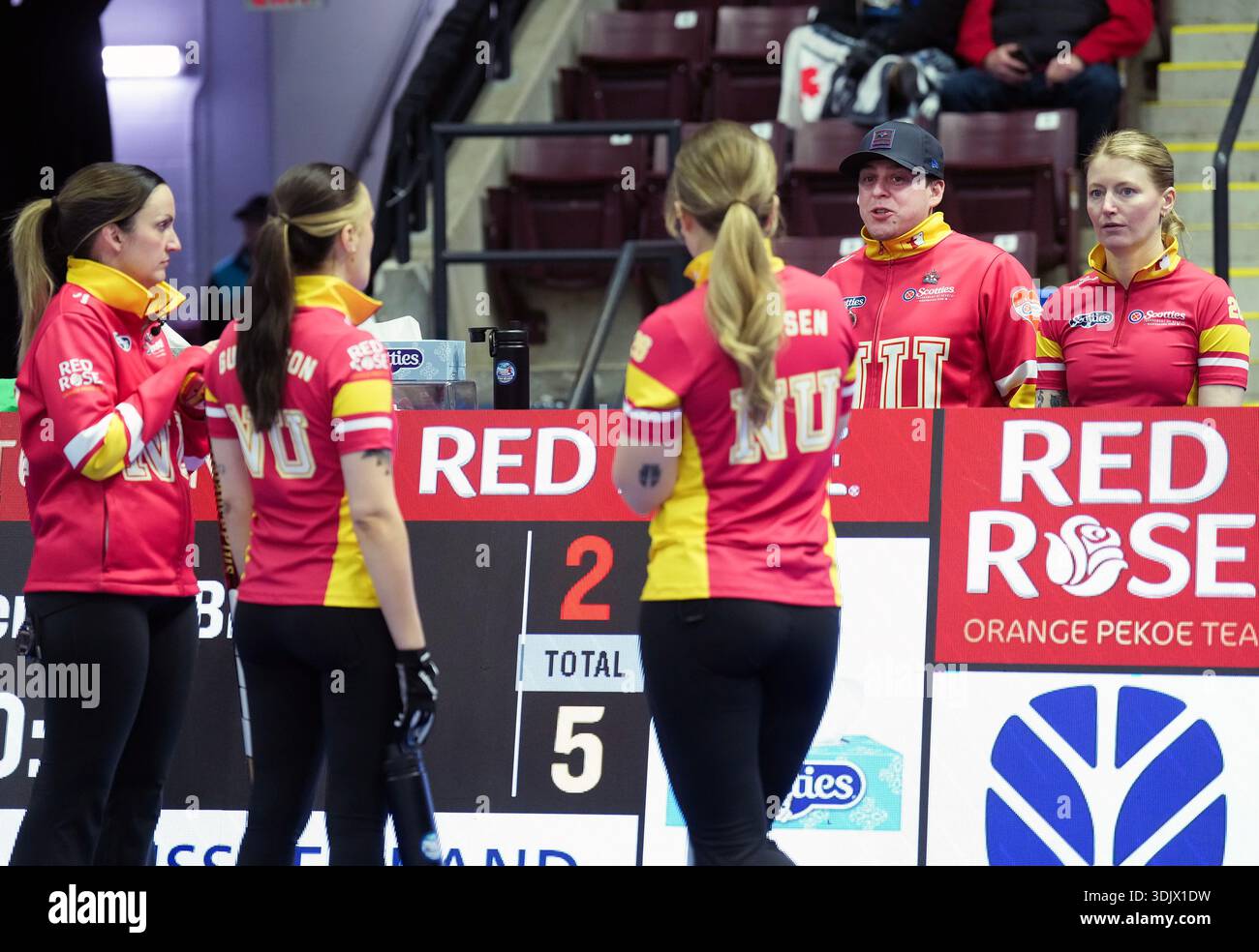 Team Nunavut coach Colin Hodgson, second right, talks with his team ...