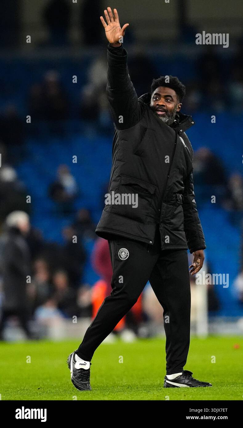 Manchester City assistant head coach Kolo Toure acknowledges the fans ...