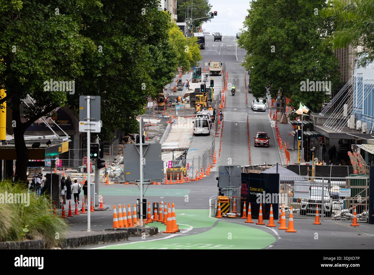 Roadworks and traffic management cones line a city street in Auckland ...