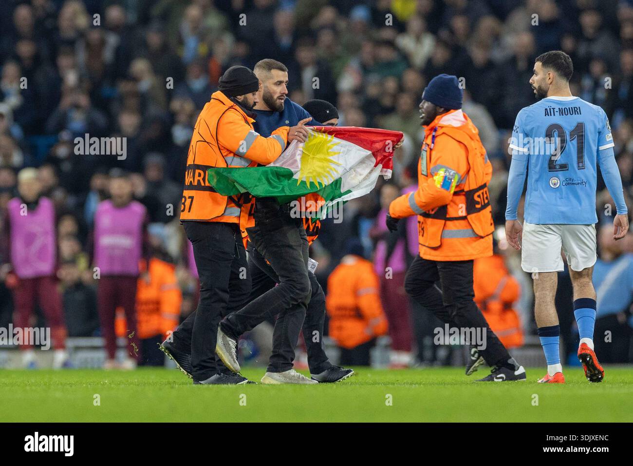 Palestinian fan runs into the pitch during the UEFA Champions League ...