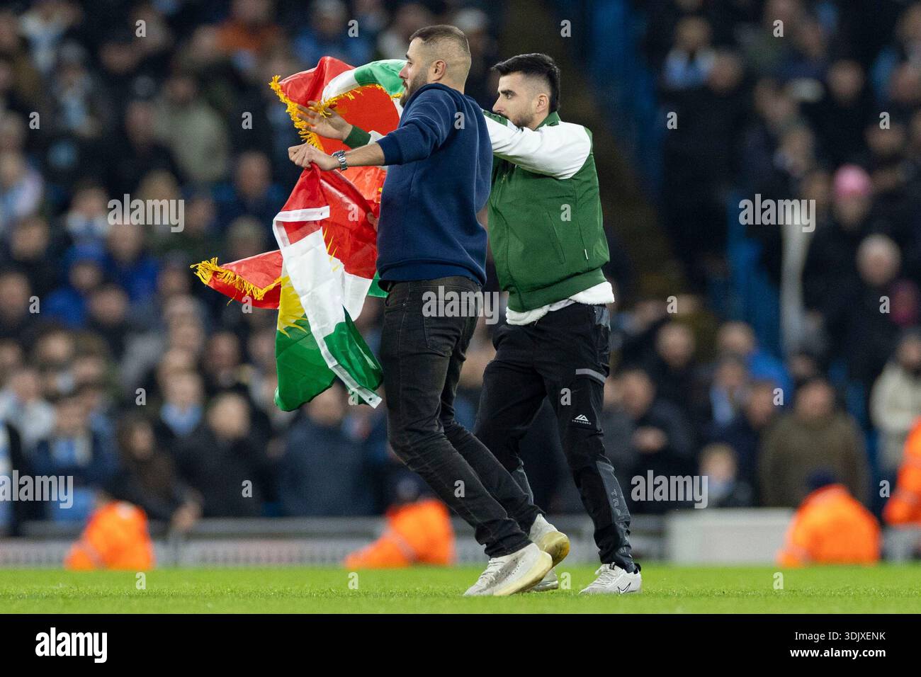 Palestinian fan runs into the pitch during the UEFA Champions League ...