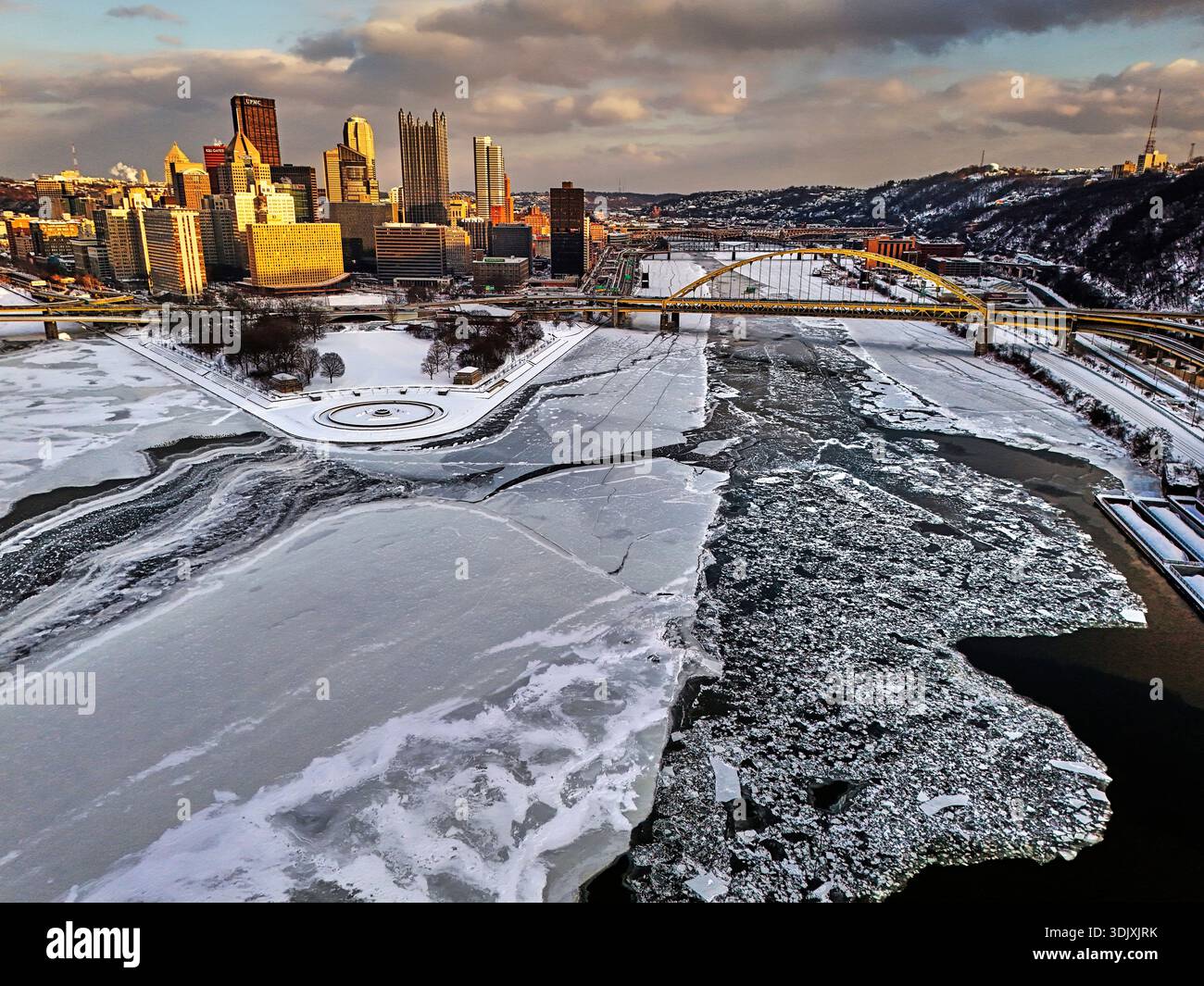 Ice covers the confluence of the Allegheny, left, Ohio, center, and ...