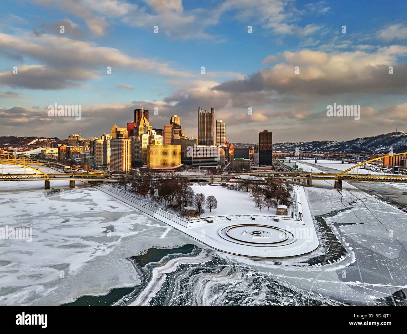 Ice covers the confluence of the Allegheny, left, Ohio, center, and ...
