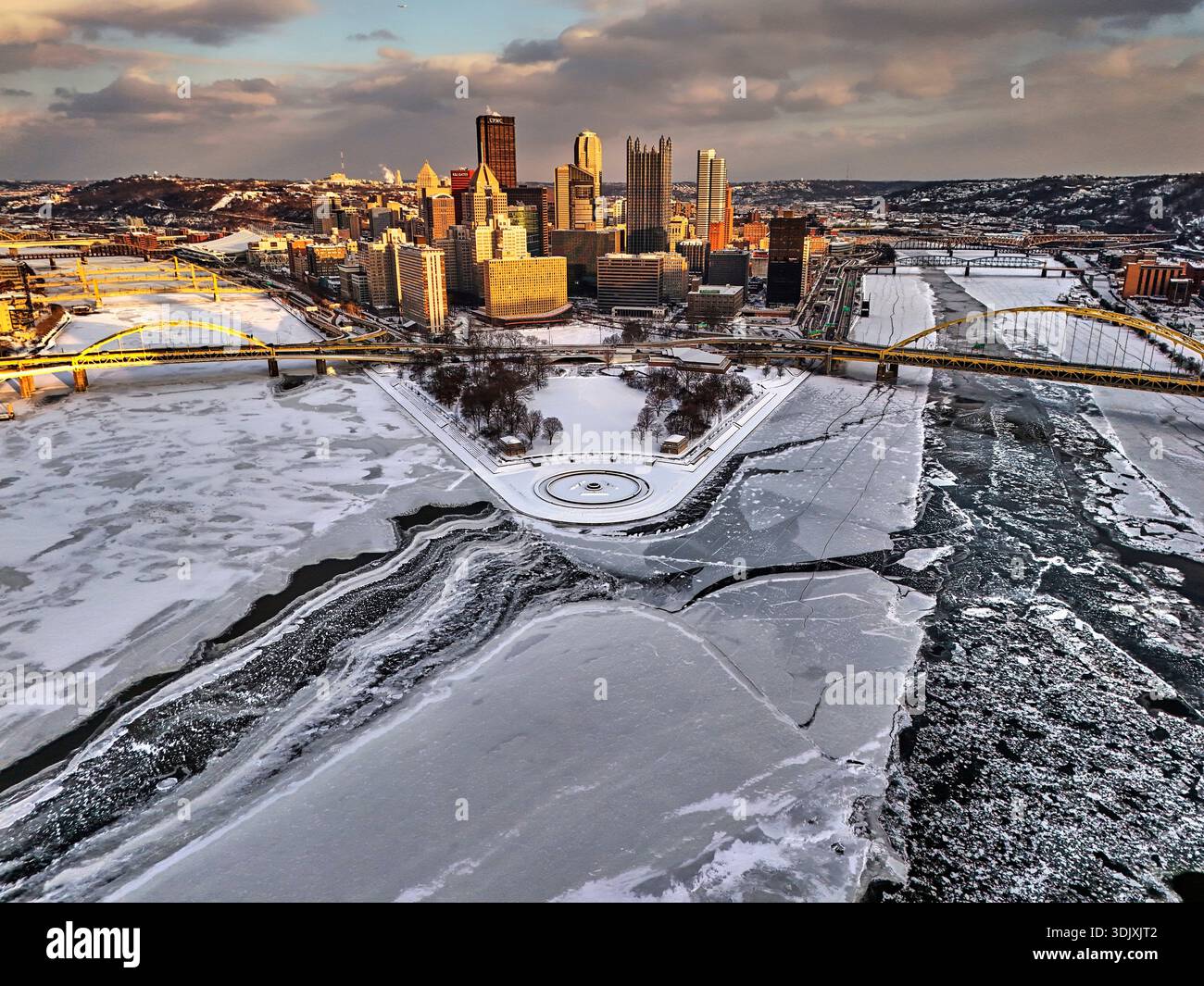 Ice covers the confluence of the Allegheny, left, Ohio, center, and ...