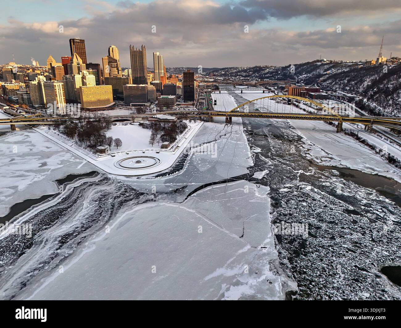 Ice covers the confluence of the Allegheny, left, Ohio, center, and ...