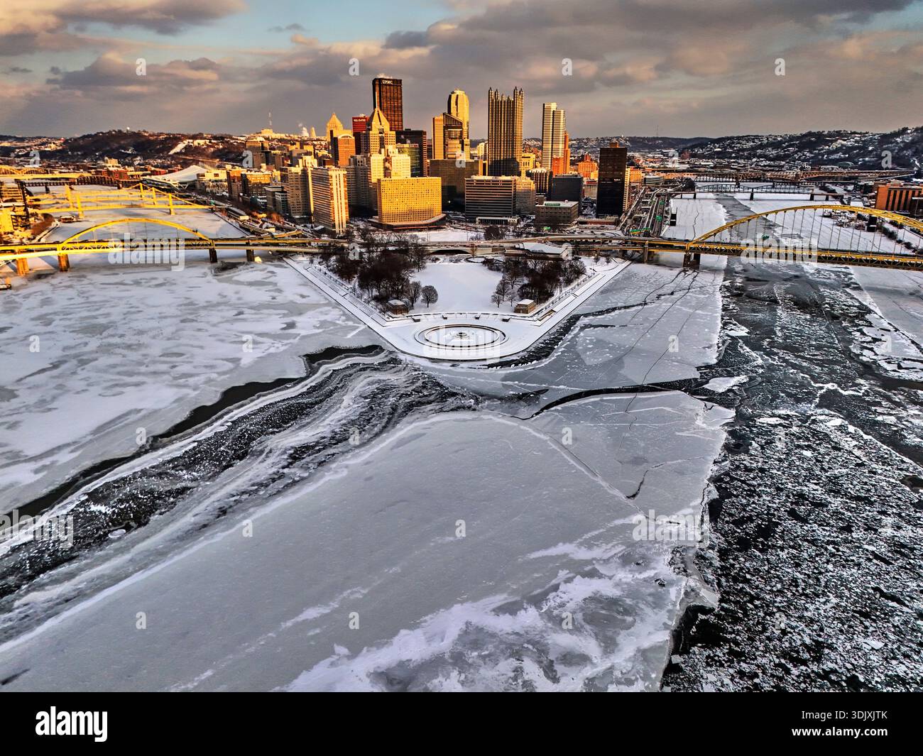 Ice covers the confluence of the Allegheny, left, Ohio, center, and ...