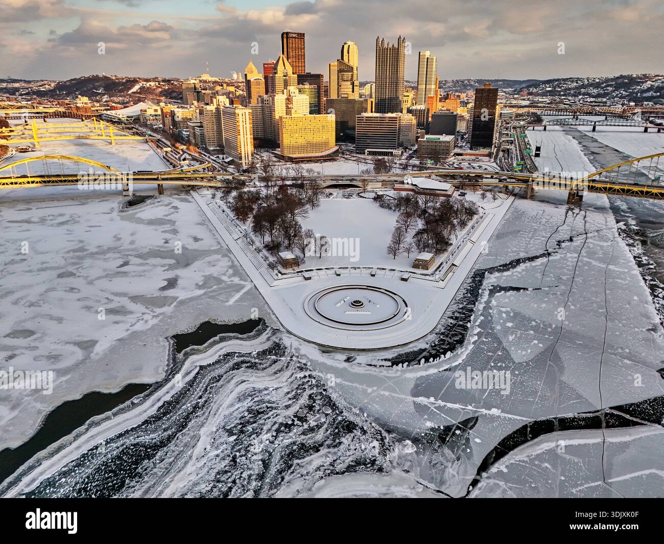 Ice covers the confluence of the Allegheny, left, Ohio, center, and ...