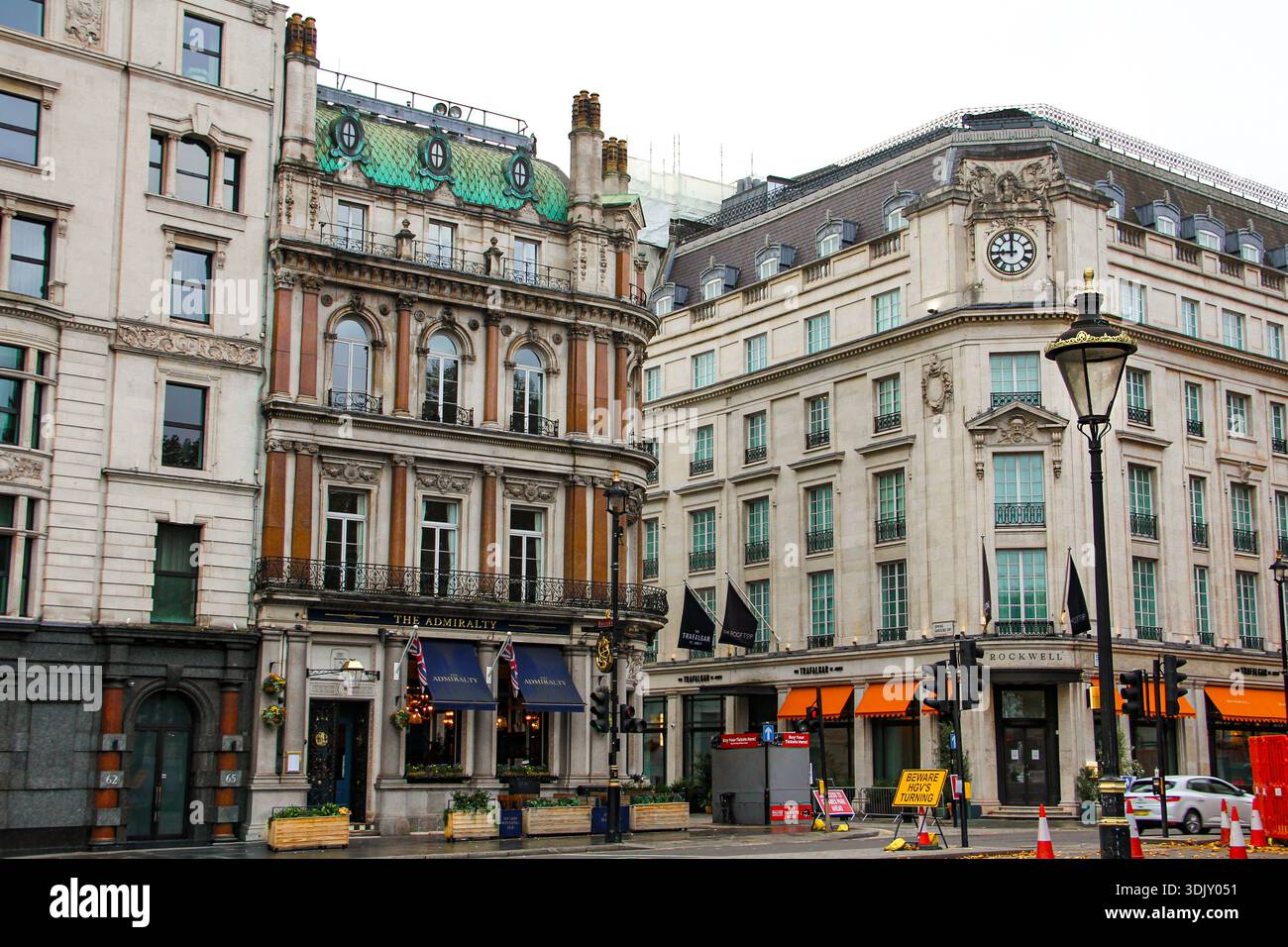 Street-level view of a busy city intersection surrounded by historic ...