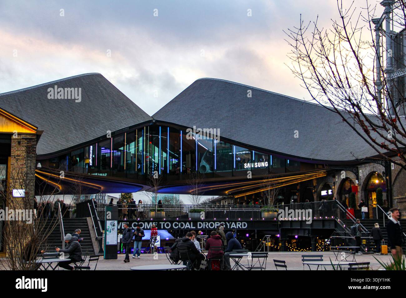 Coal Drops Yard in King’s Cross at sunset, with stylish rooftops and ...