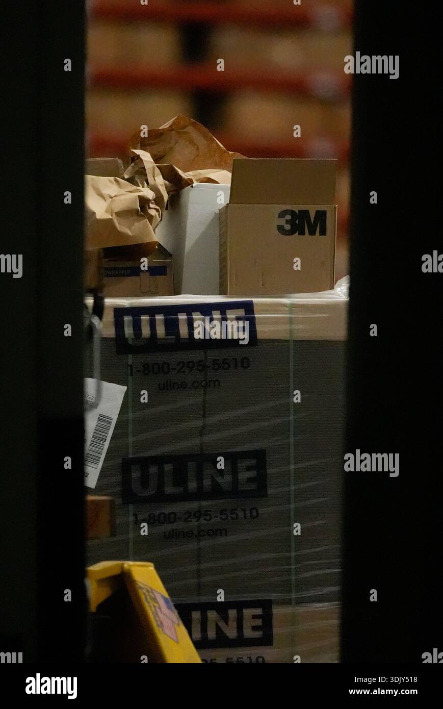 Equipment is loaded into a truck inside the Fulton County Election HUB ...