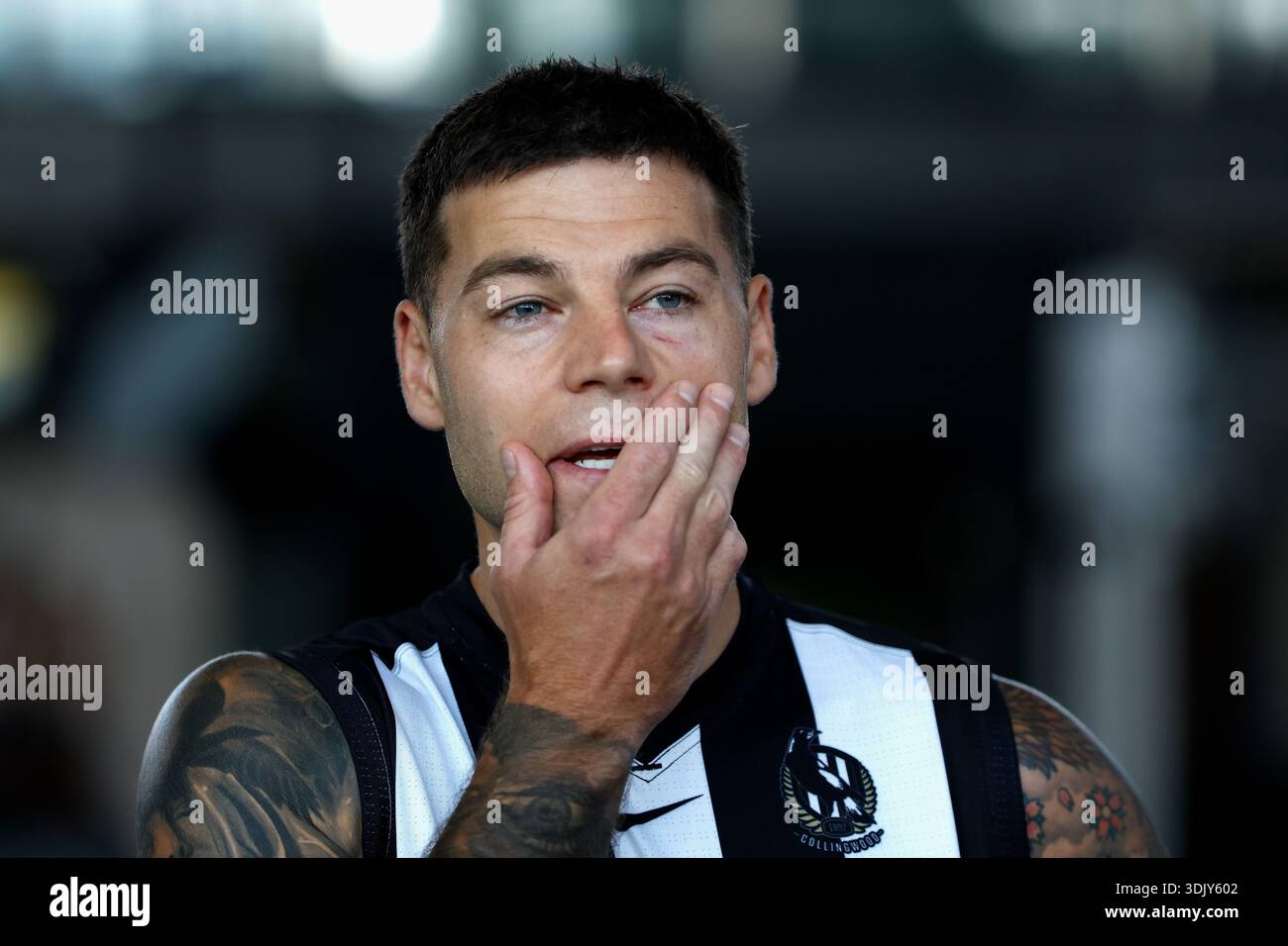 Jamie Elliott speaks to media prior to the Collingwood AFL players pose ...