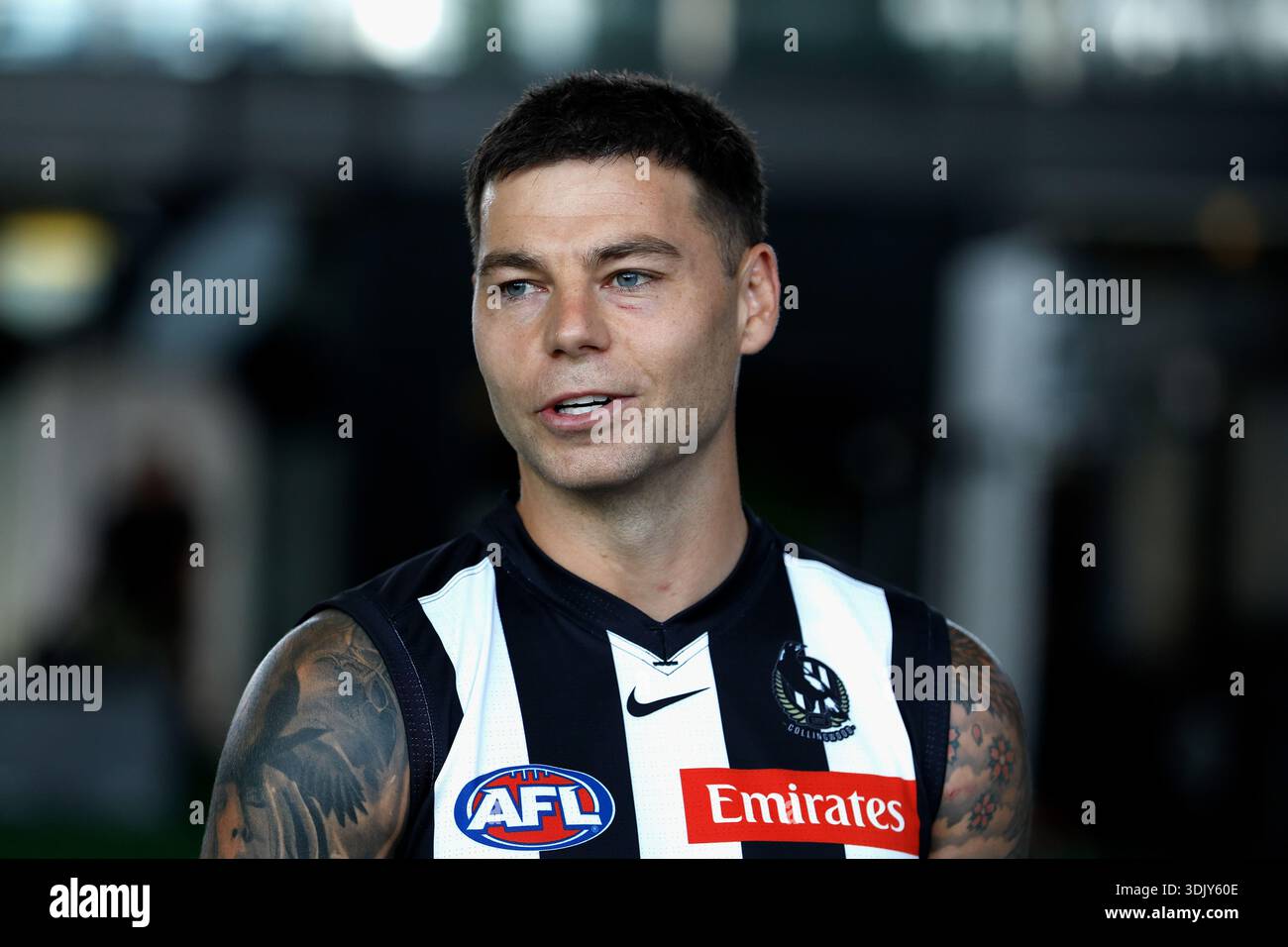 Jamie Elliott speaks to media prior to the Collingwood AFL players pose ...