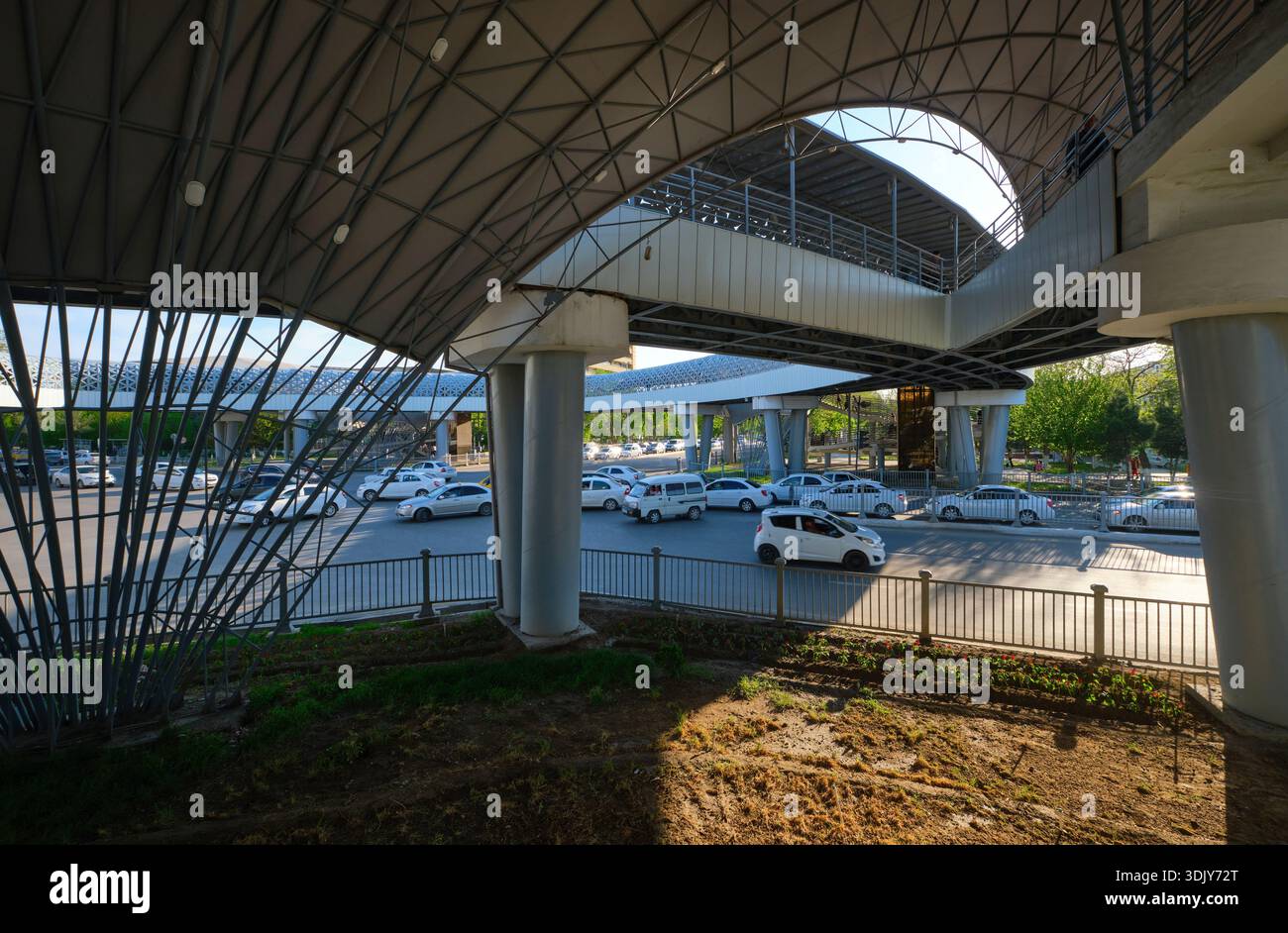 The modern, raised pedestrian walkway over the vehicle intersection in ...