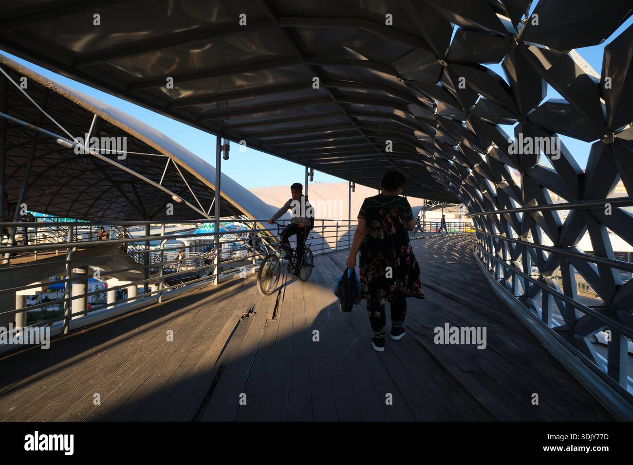 The modern, raised pedestrian walkway over the vehicle intersection in ...