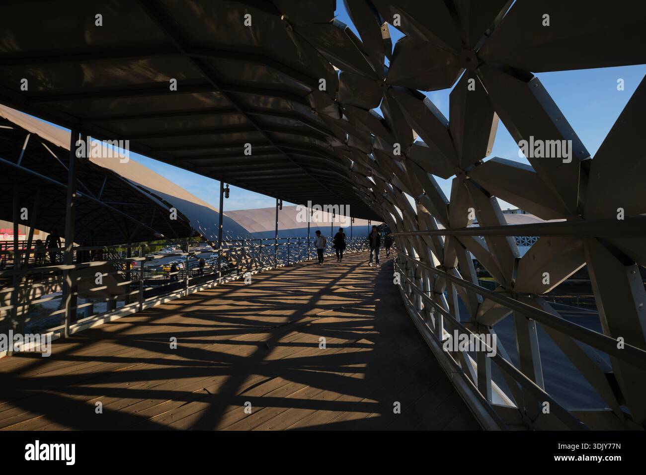 The modern, raised pedestrian walkway over the vehicle intersection in ...