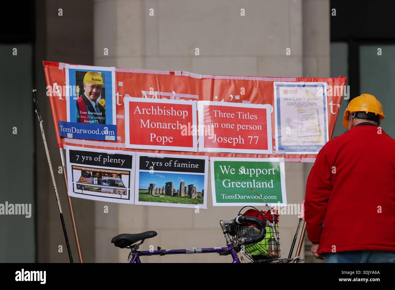A man looks at a banner outside St Paul's Cathedral during Dame Sarah ...