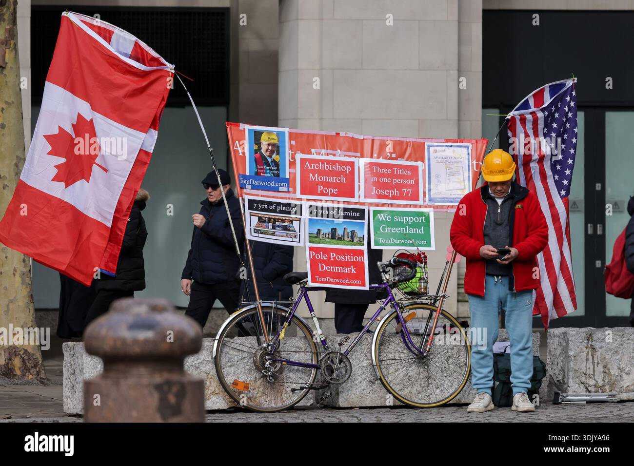 A man stands next to a banner outside St Paul's Cathedral during Dame ...