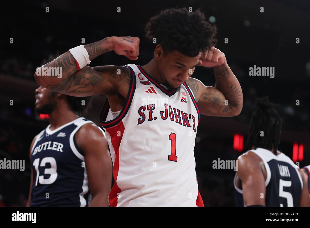St. John's forward Dillon Mitchell (1) flexes after scoring and drawing ...