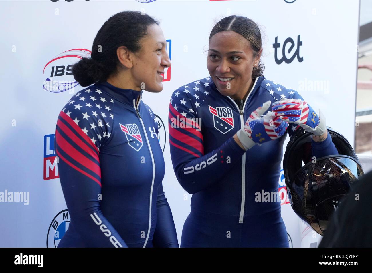 FILE - Fifth placed Elana Meyers Taylor and Azaria Hill of USA react ...