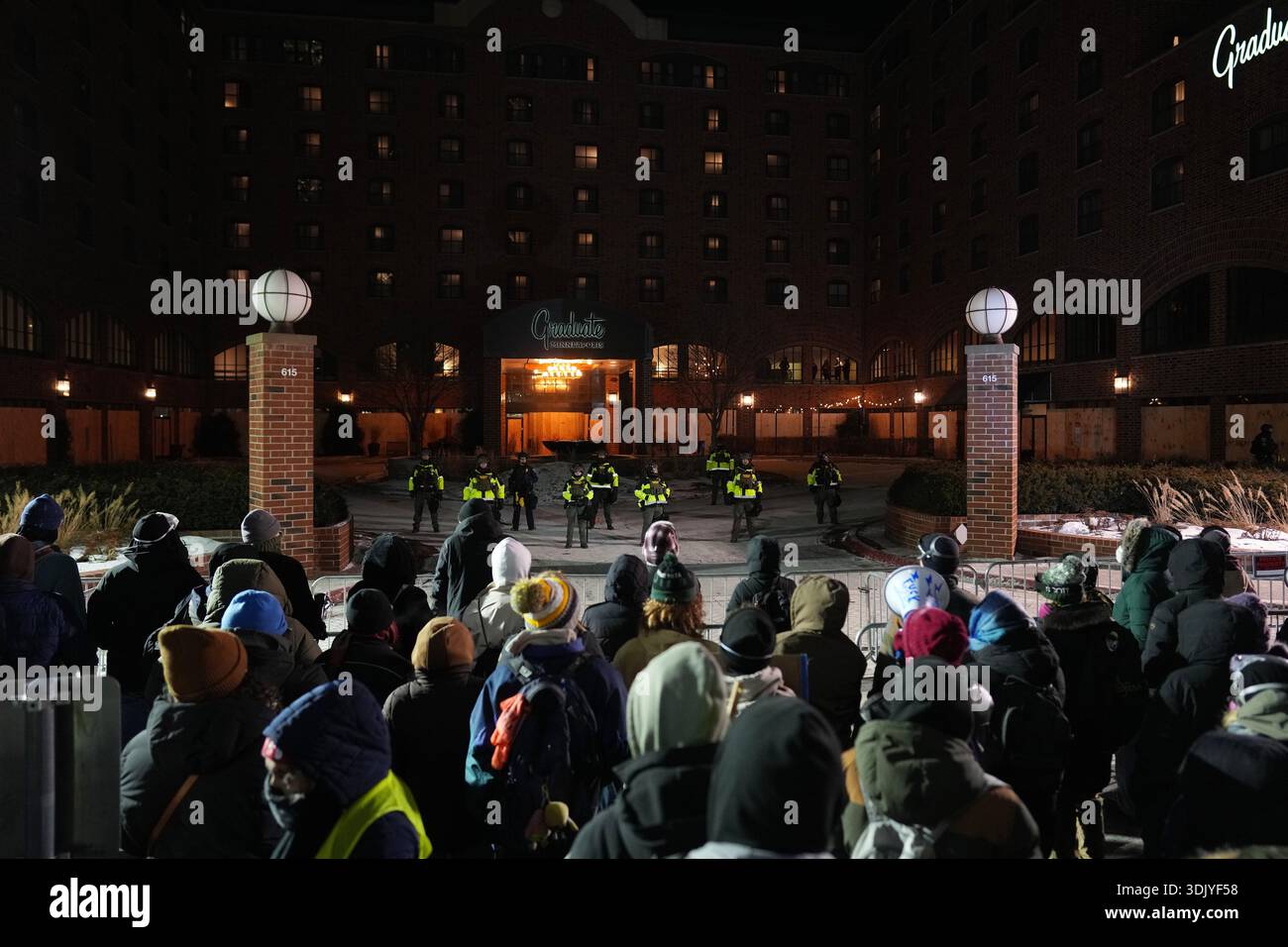 People participate during a noise demonstration outside the Graduate by ...