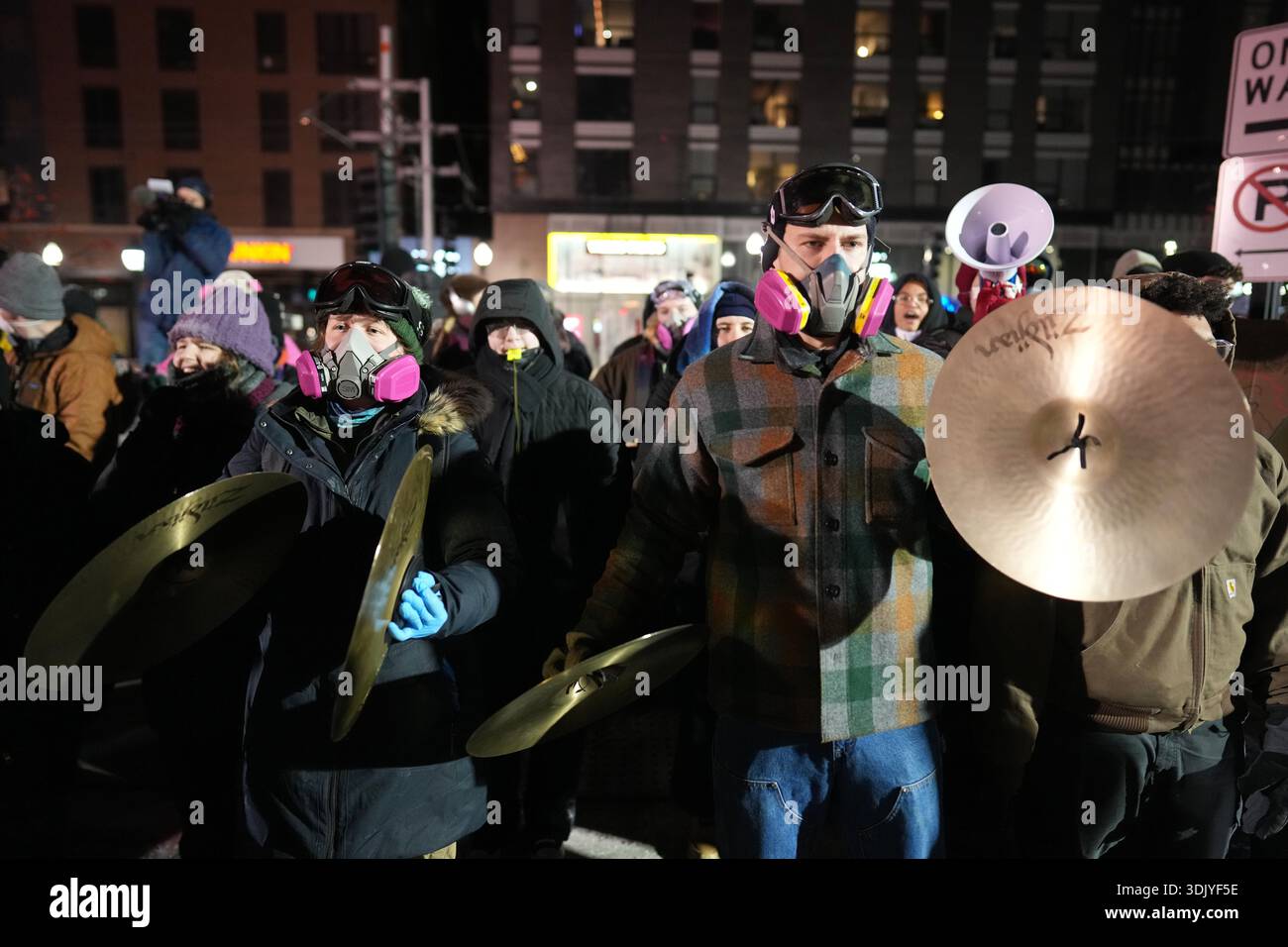People participate during a noise demonstration outside the Graduate by ...