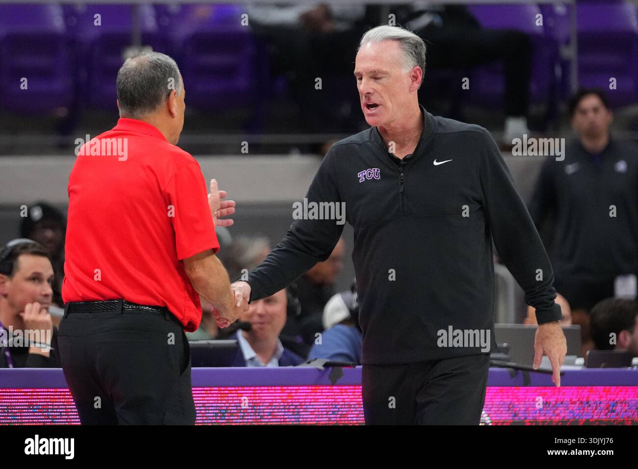 Houston head coach Kelvin Sampson, left, shakes hands with TCU head ...