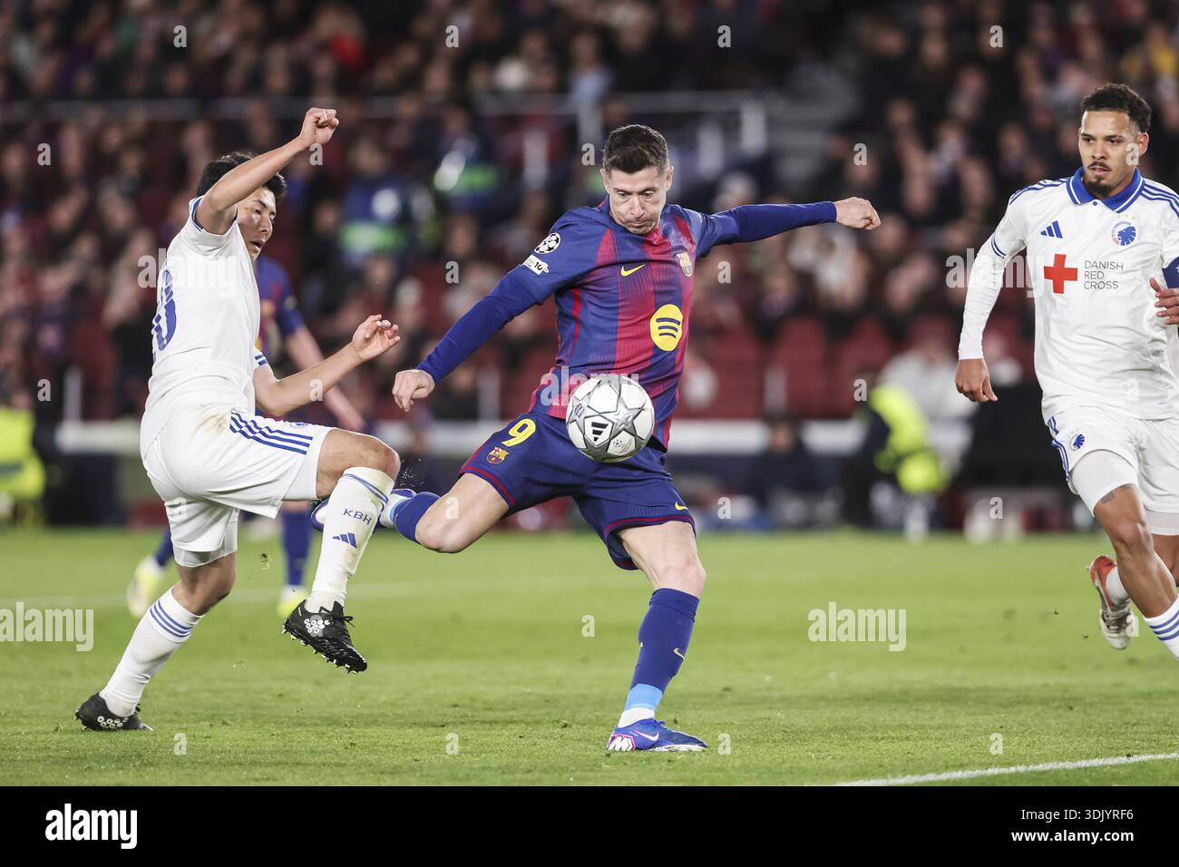 Robert Lewandowski of FC Barcelona and Junnosuke Suzuki of Copenhagen ...