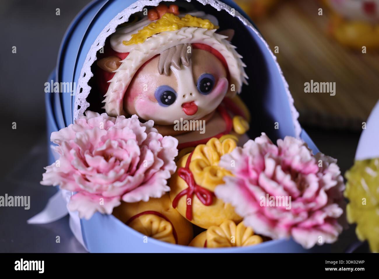 A worker displays freshly steamed traditional flower buns at a heritage ...