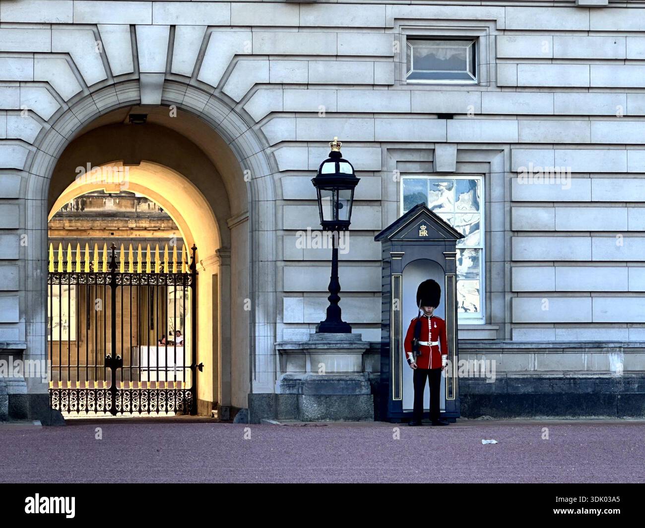 British guard standing sentry at Buckingham Palace in London, wearing ...