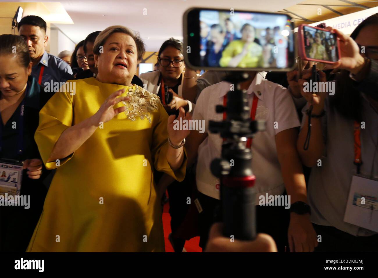 Philippine Foreign Secretary Theresa Lazaro, front left, is surrounded ...