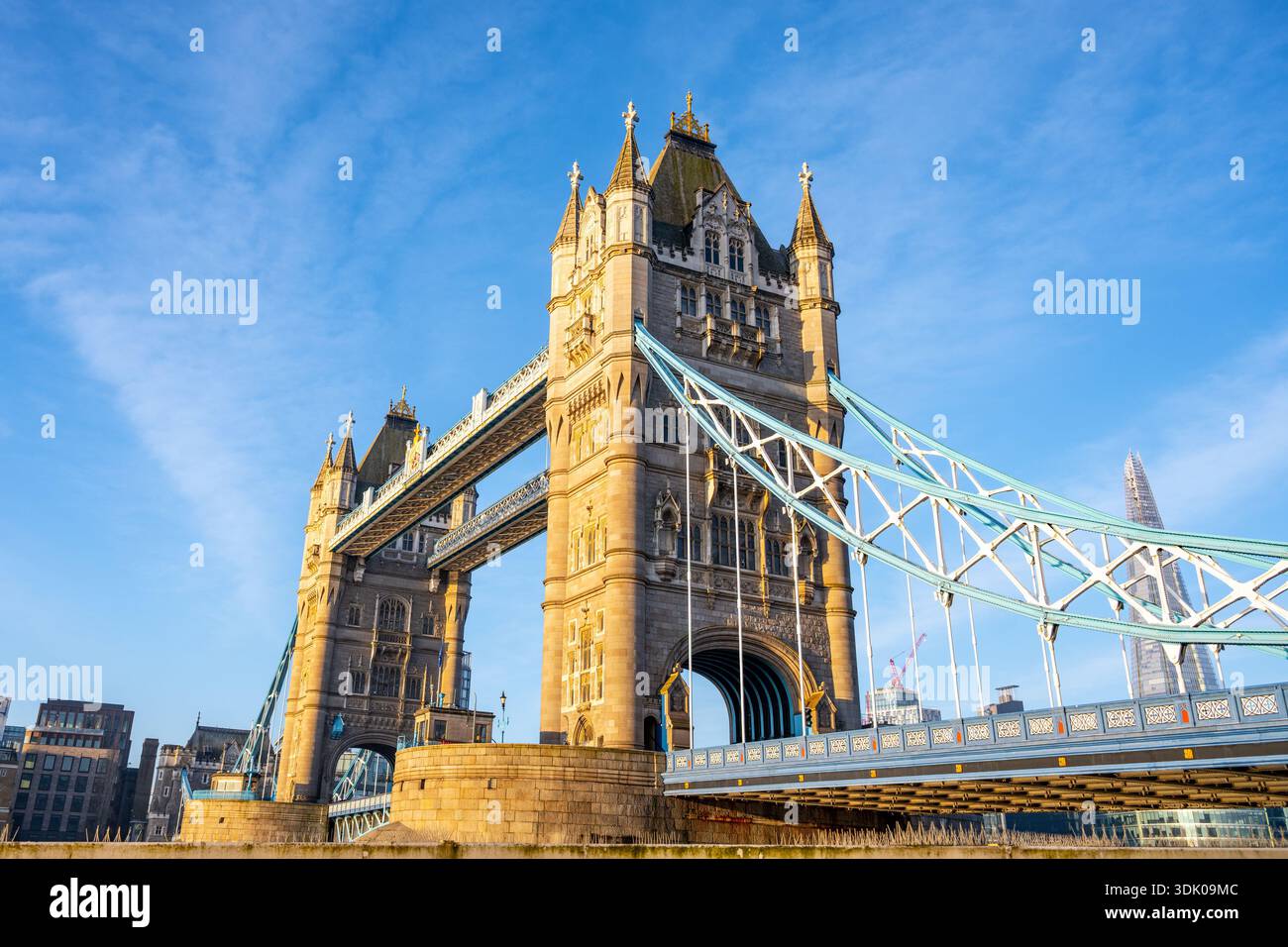 Tower Bridge stands majestically in the morning light, with clear skies ...