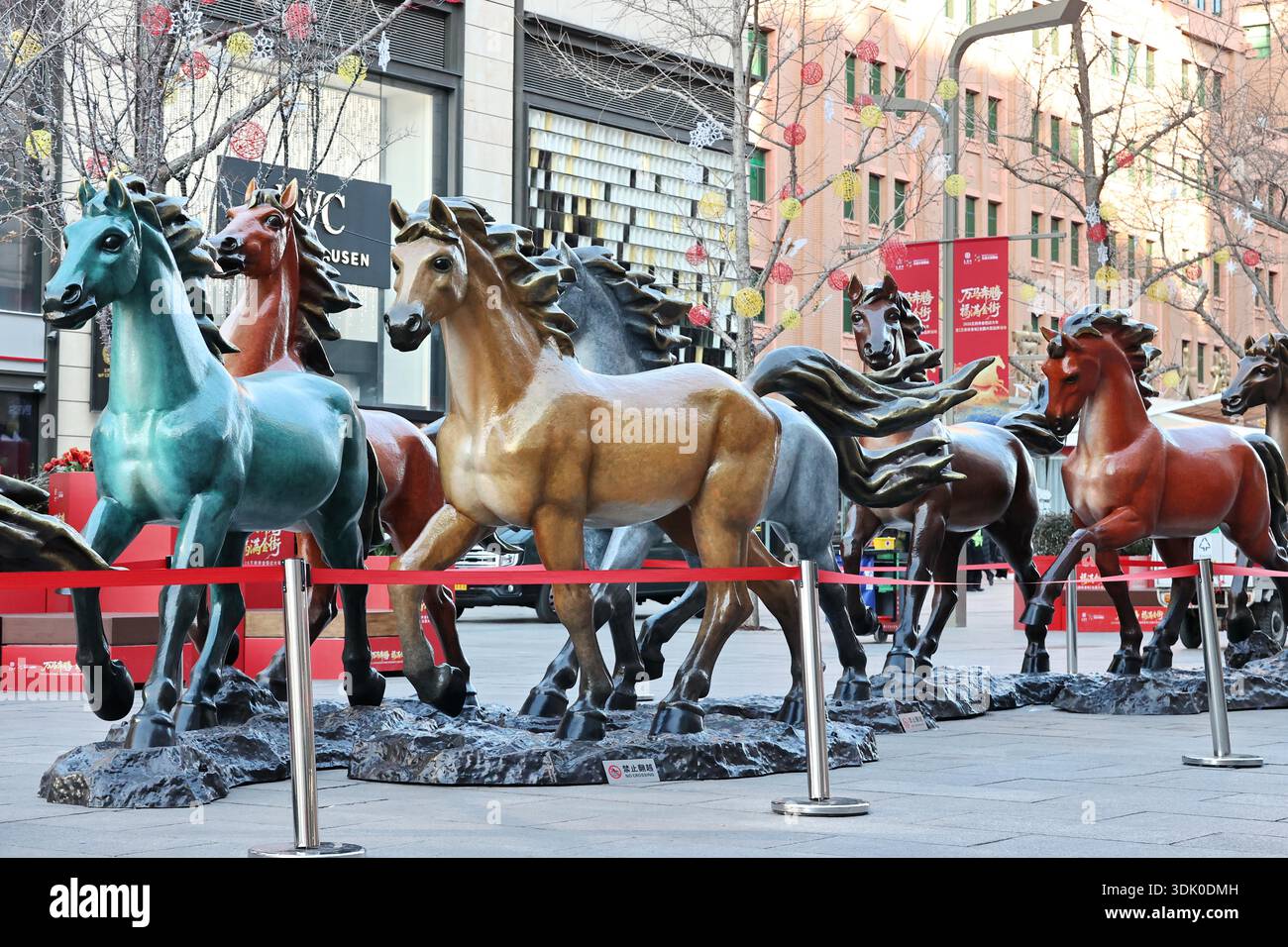 Visitors take photos with the 13-meter-long bronze artwork in ...