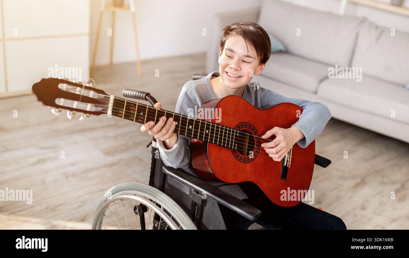 Boy wheelchair guitar hi-res stock photography and images - Alamy
