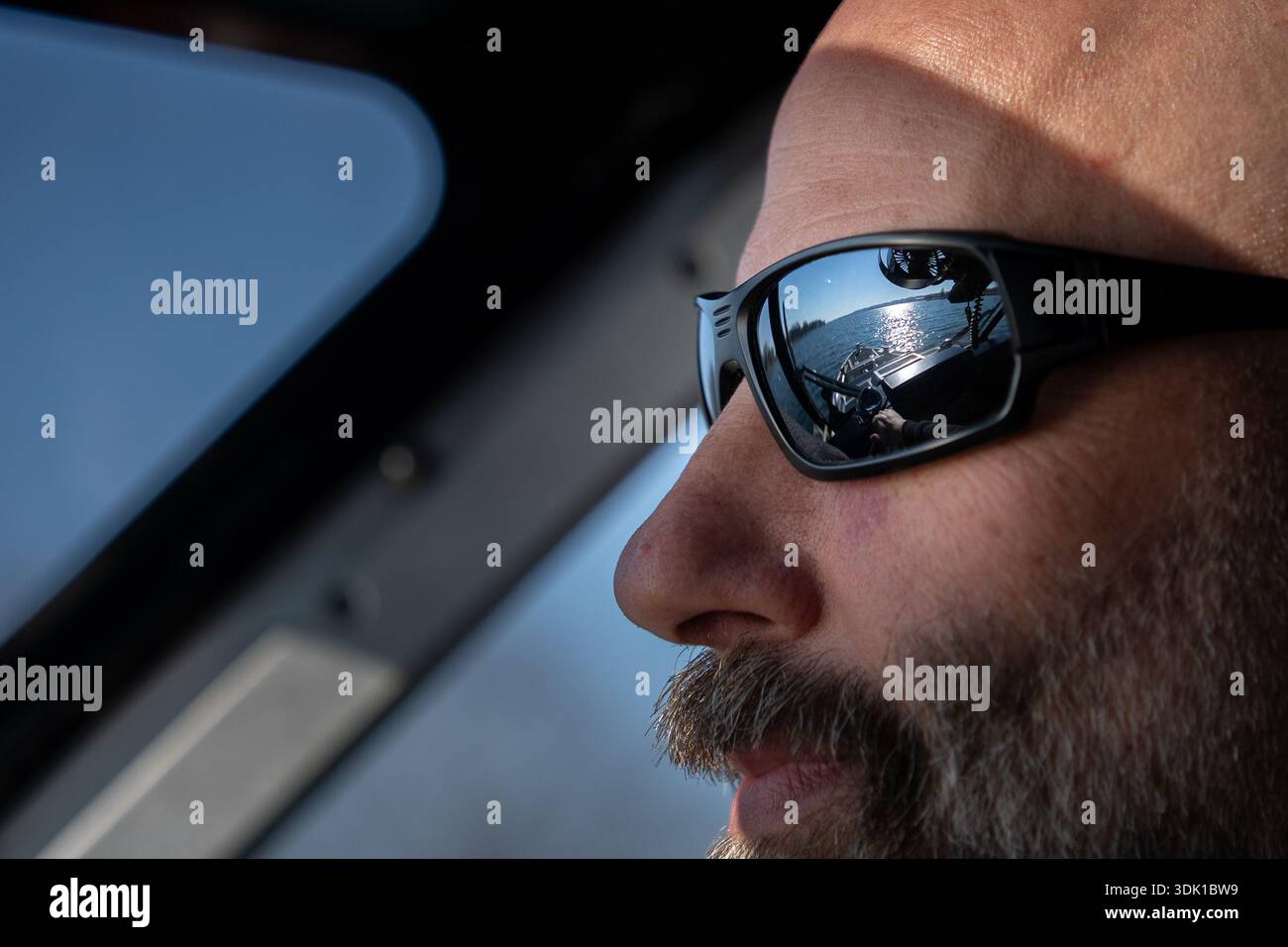 Metropolitan Police Department diver Jeffrey Leslie pilots a boat along ...