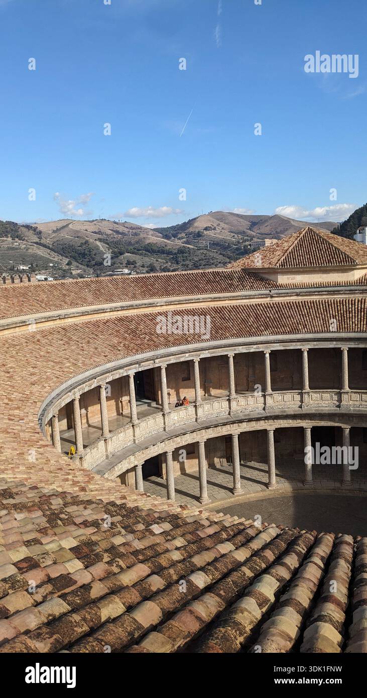 Circular rooftop of the Renaissance Palace of Charles V with Sierra ...