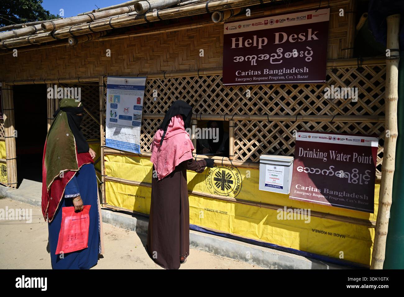 Rohingya refugees receive emergency support at an NGO support center ...