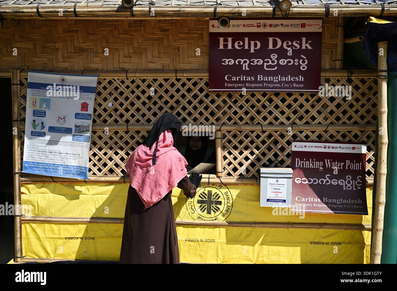 Rohingya refugees receive emergency support at an NGO support center ...