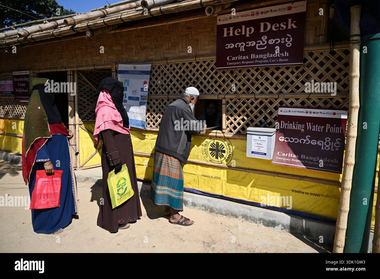 Rohingya refugees receive emergency support at an NGO support center ...