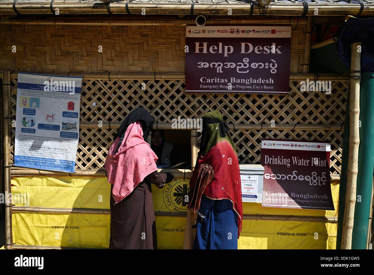 Rohingya refugees receive emergency support at an NGO support center ...
