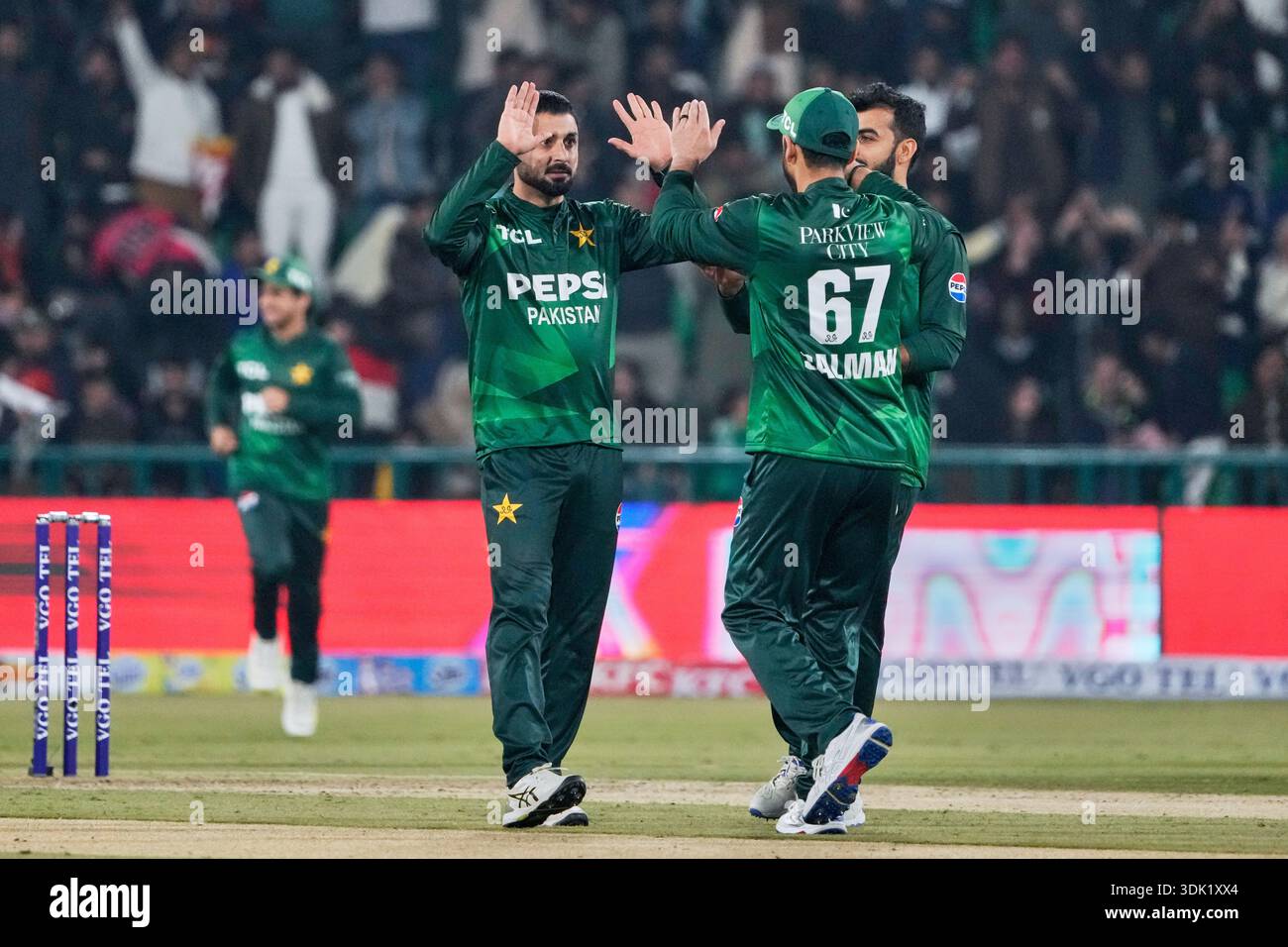 Pakistan's Abrar Ahmed, left, celebrates with teammates after the ...